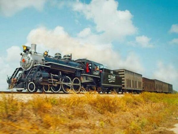 U.S. Sugar Steam Locomotive No. 148 Hauls Sugarcane Train to Mill ...